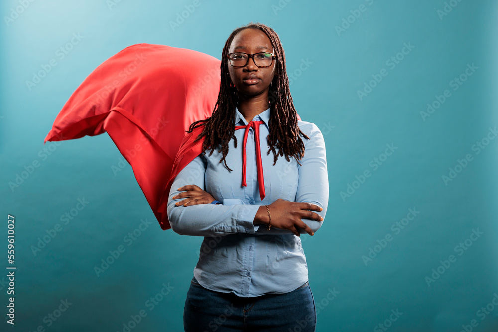 Foto de Brave and proud young adult person with superpowers on blue ...