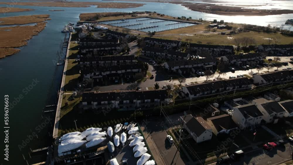 An aerial view over a residential neighborhood by the salt marshes in ...