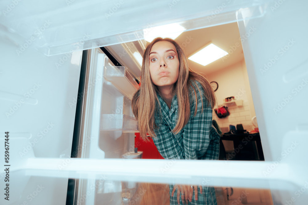 Confused Girl Looking into Her Empty Refrigerator Unhappy woman ...
