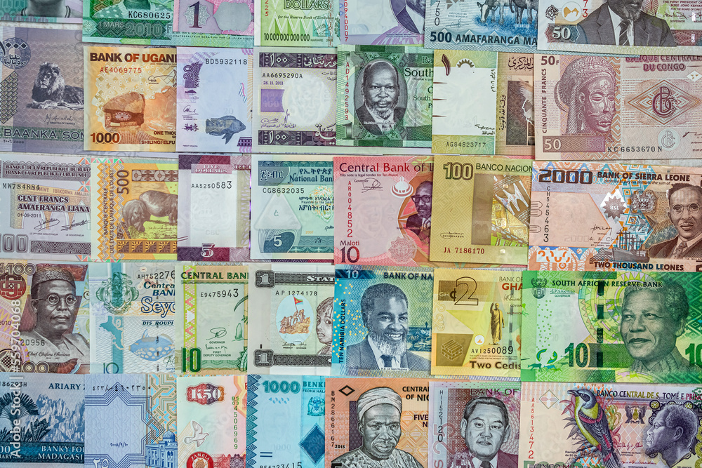 Various African banknotes stacked on top of each other forming a money ...