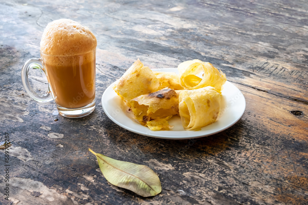 Malaysian food. Roti tissue, roti tisu, or tissue prata is a sweet ...