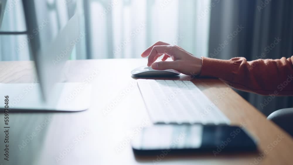 B roll - Close-up of a woman hand using white wireless mouse on a work ...