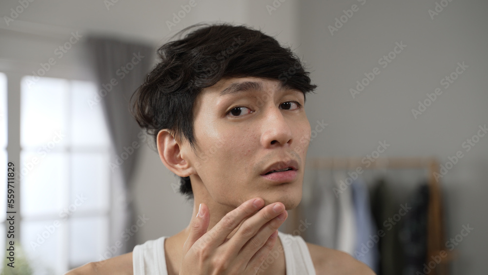 asian Japanese man nodding head and smiling at camera as mirror while ...