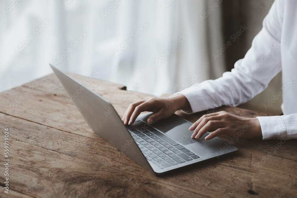 Person typing on laptop keyboard, businessman working on laptop, he is ...