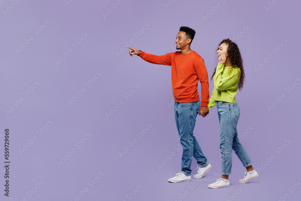 Full body side view young couple two friend family man woman of African ...