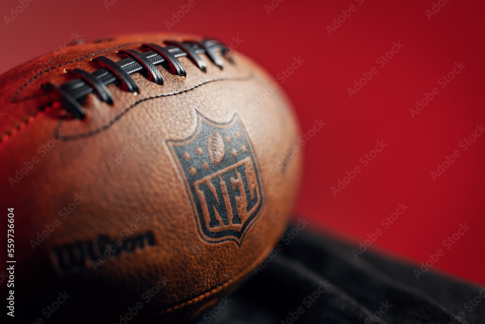 A football in epic light situation with the logo of the official brand ...