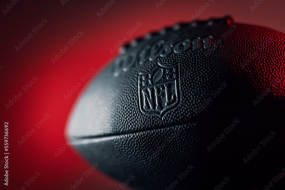 A football in epic light situation with the logo of the official brand ...