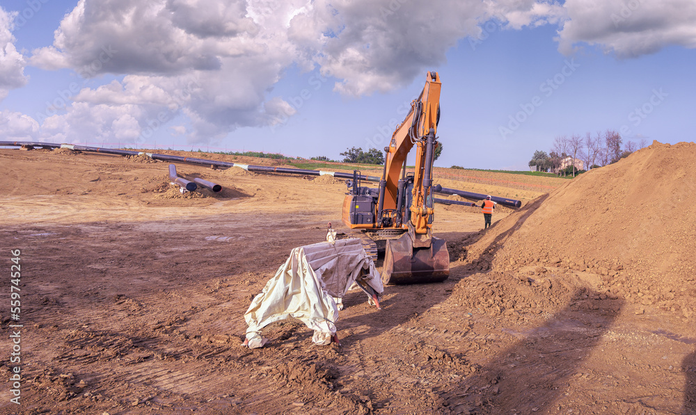 Gas pipeline construction,Excavator with bucket moves earth for ...