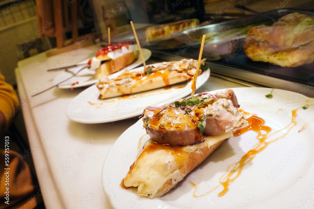 Tapas bar background. Spanish food restaurant. Snacks eating. Small ...