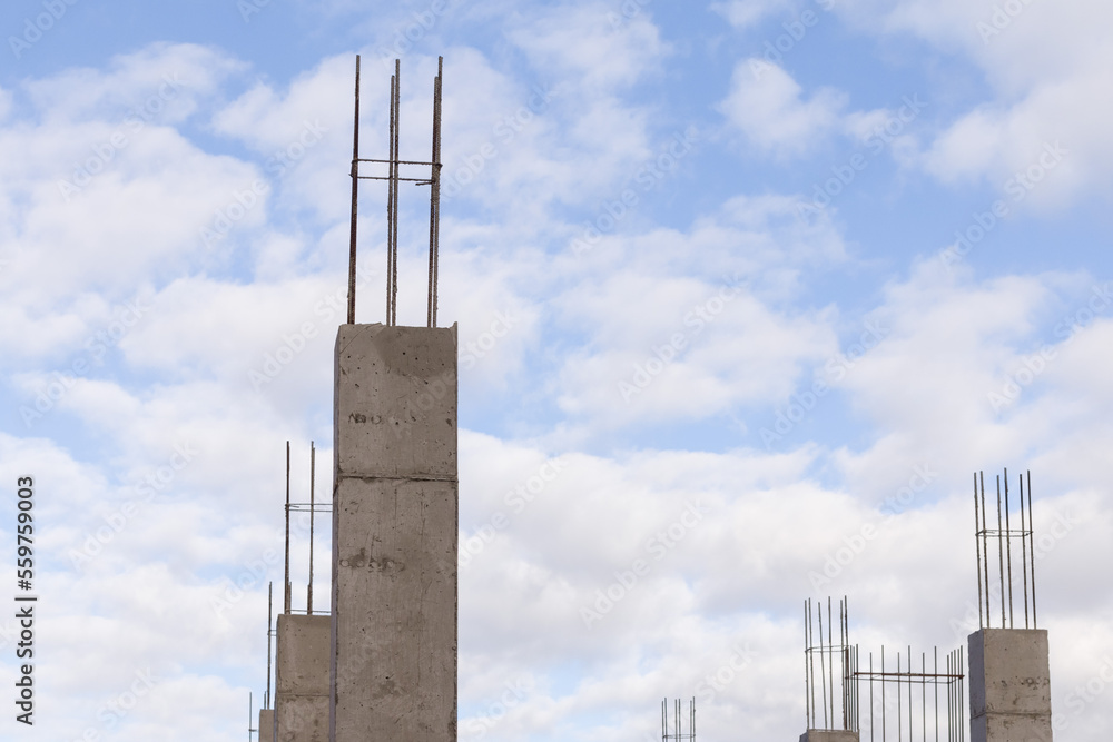 construction of an industrial building site with a line of concrete ...