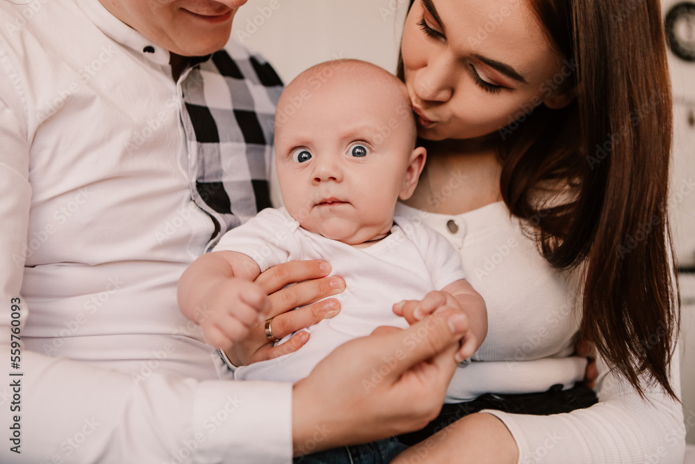 Little boy pop-eyed surprised cute child baby playing with parents ...