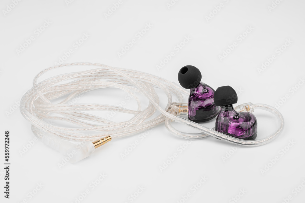 In ear monitor on a tablature background. Custom in-ear monitors with ...