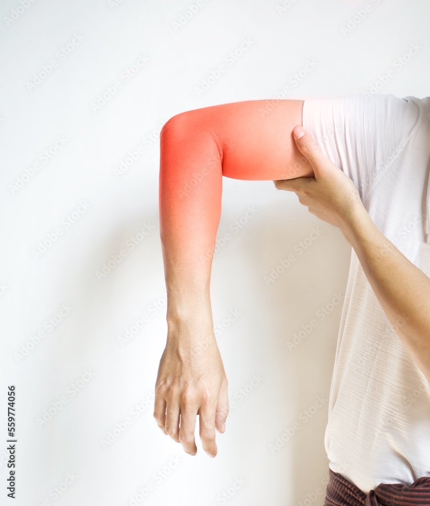Pain in the upper arm of Asian young man. Concept of elbow and forearm ...