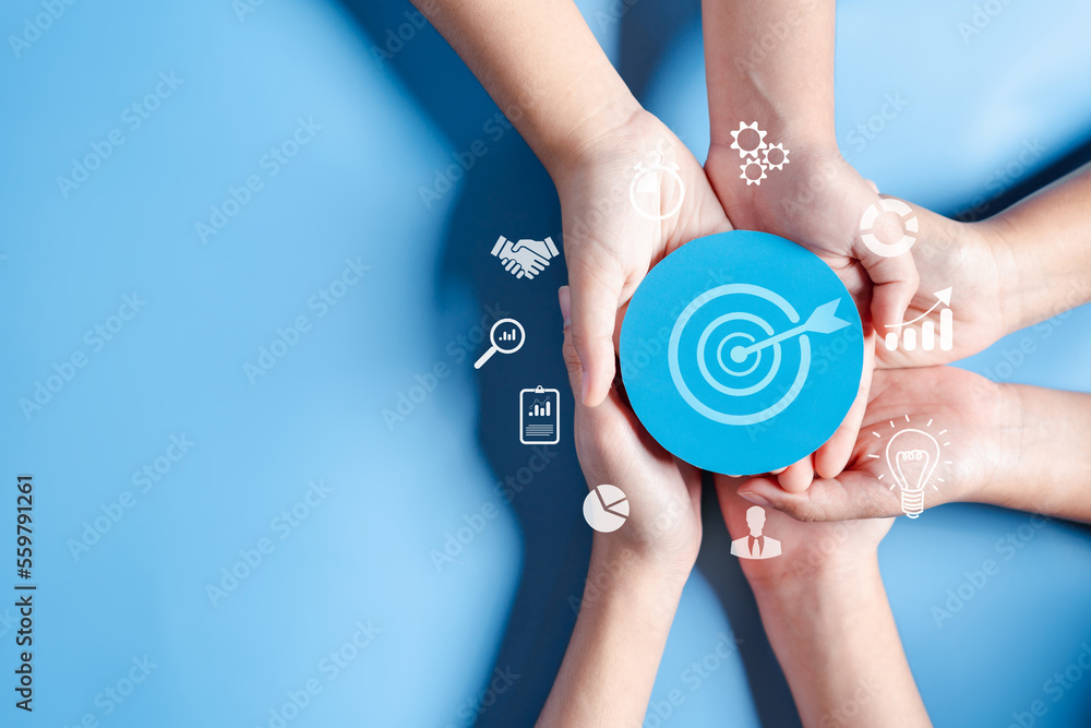 Business hands holding target icon, dartboard and arrow for creative ...
