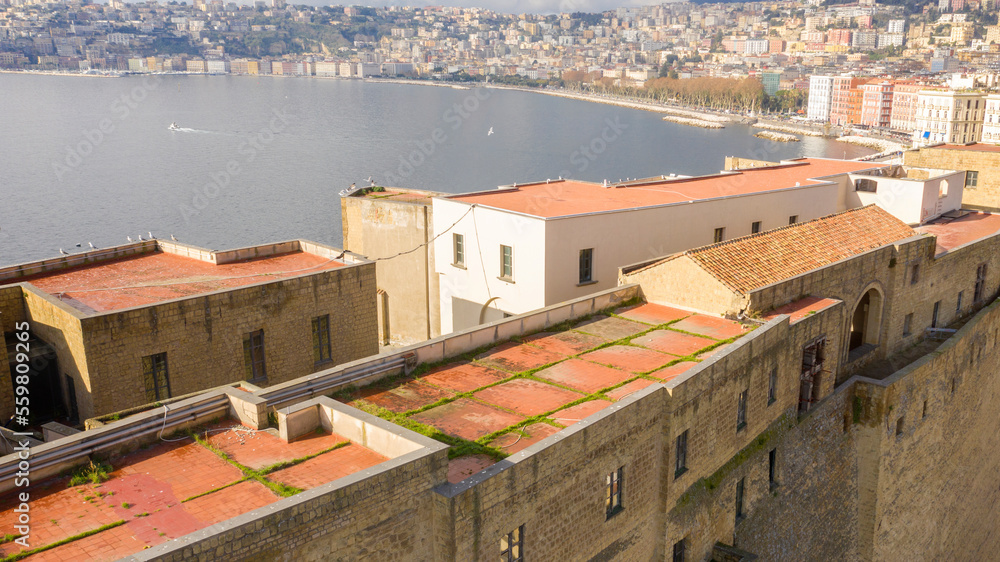 Aerial view of Castel dell'Ovo, a seafront castle located on a ...
