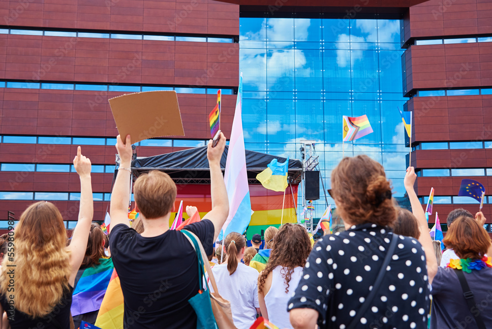 People crowd with LGBTQ rainbow flags on pride parade. Tolerance ...