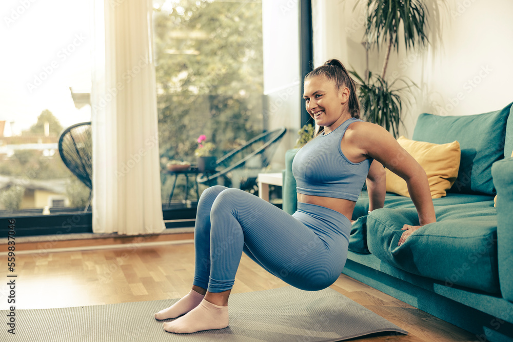 Woman Doing Workout At Home Stock Photo | Adobe Stock