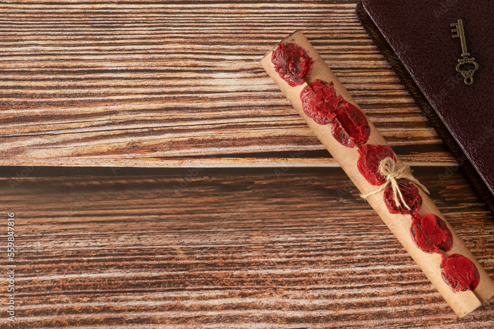 Ancient scroll with seven seals and antique key with closed holy bible ...