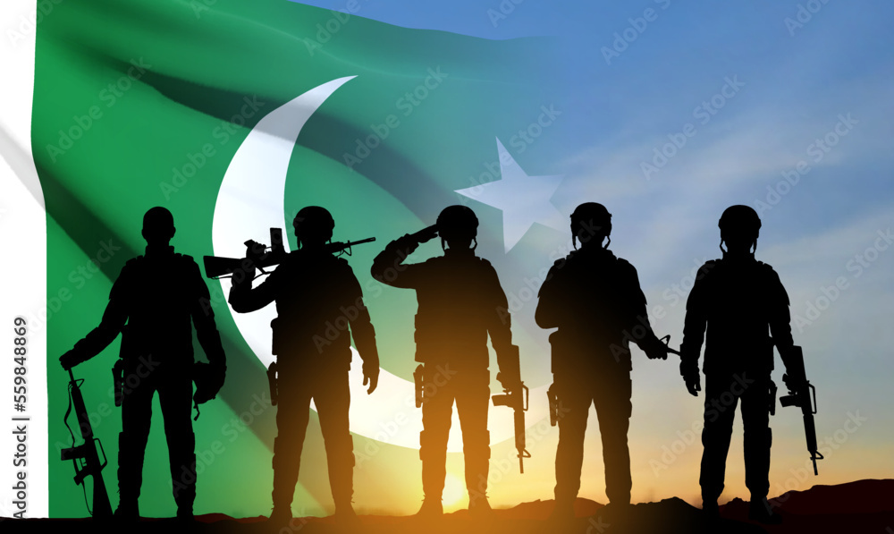 SIlhouettes of soldiers on background of sunset and Pakistan Flag ...