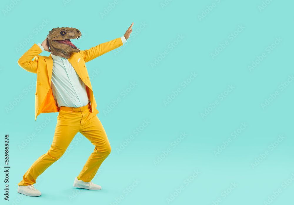 Strange guy in reptile costume dancing and having fun. Crazy young man ...