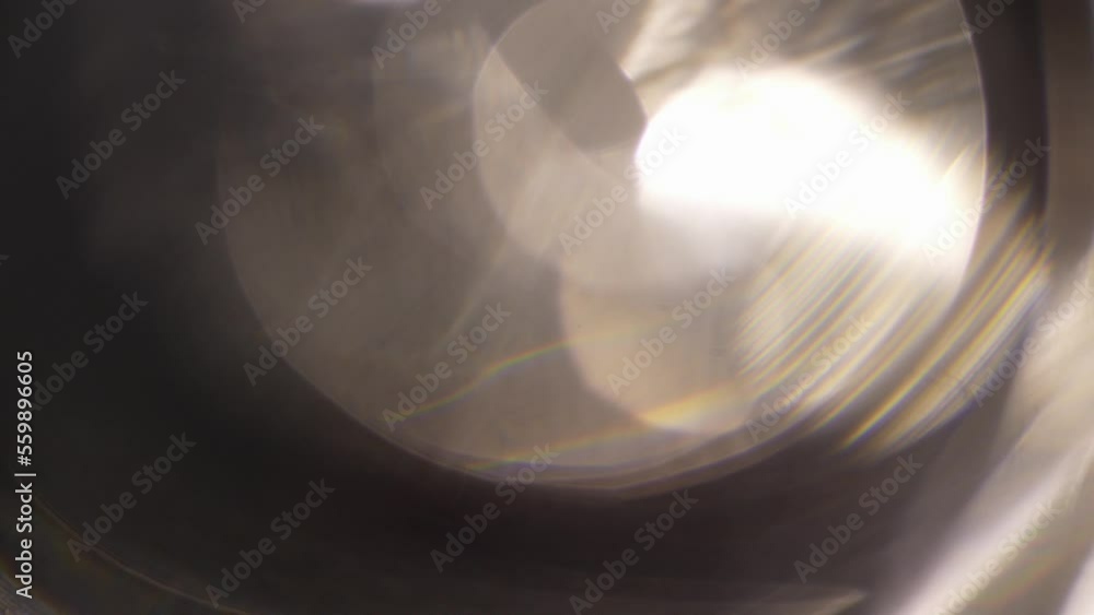 Light permeates the frames on a black background. Studio lens flare ...
