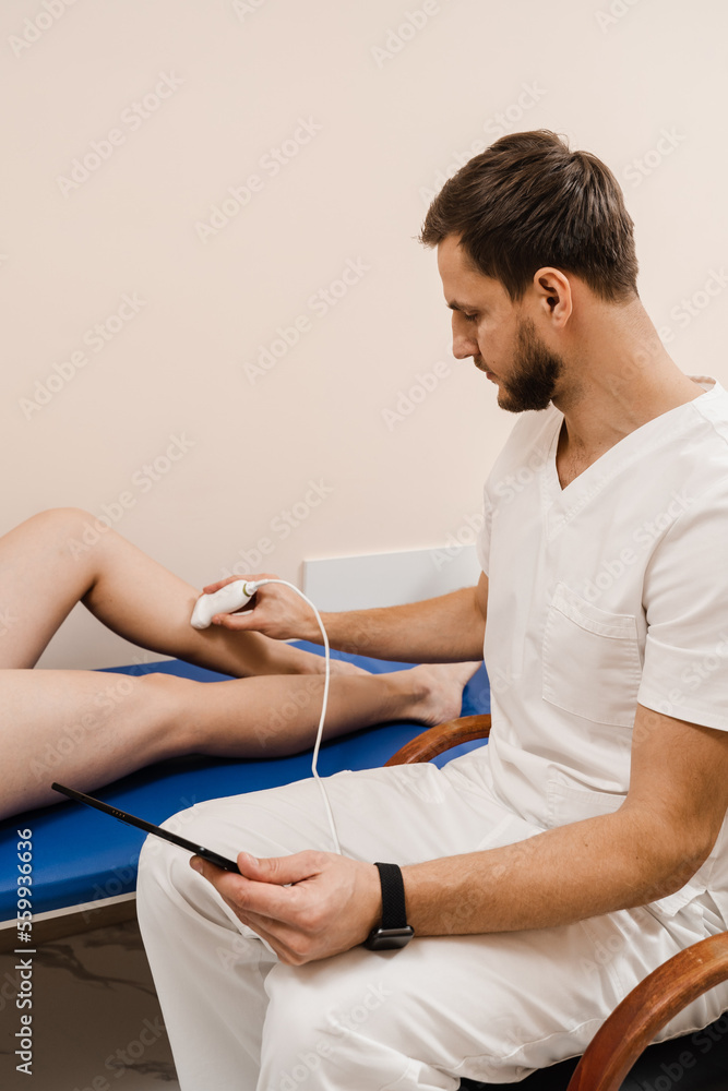 Legs ultrasound scan veins and arteries of woman. Vascular surgeon ...