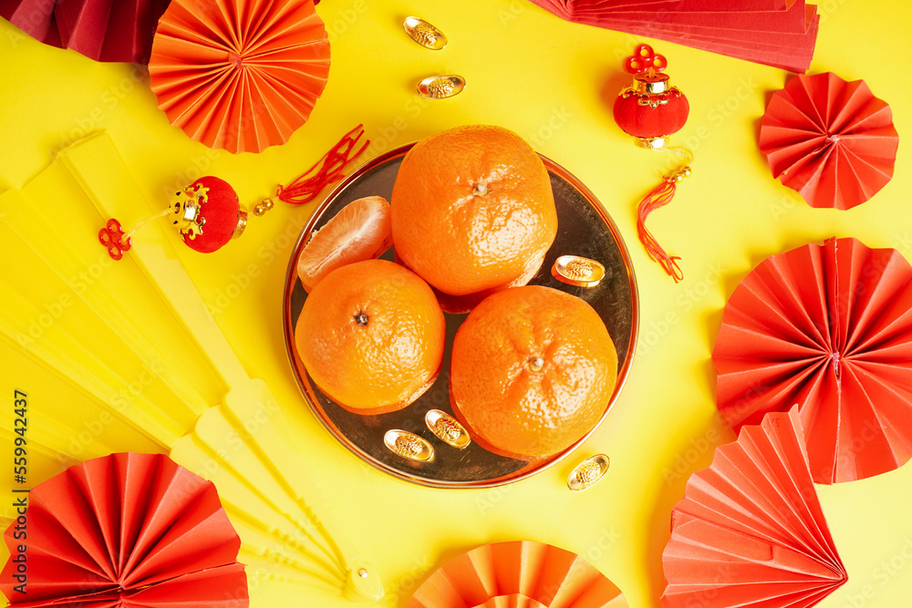 Mandarins with Chinese symbols on yellow background Stock Photo | Adobe ...