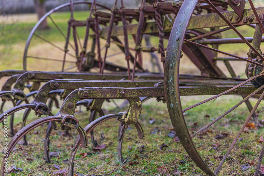 Vintage plowing machine in the field. Old rusted farm machinery. Old ...