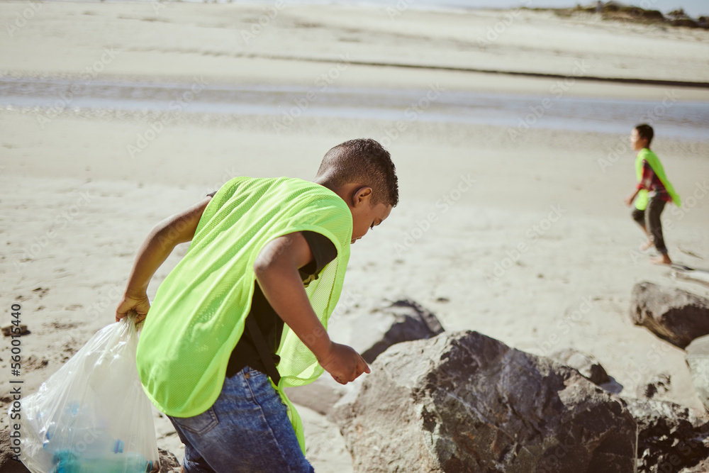 Foto de Environment, cleaning and children with plastic on beach for ...
