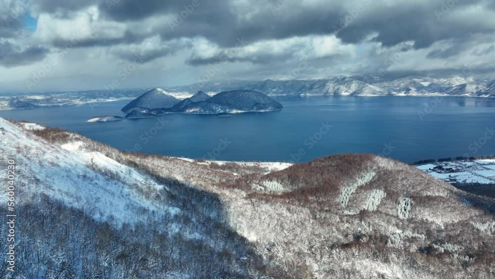 winter in Hokkaido, Japan, aerial view of snowy mountains round ...