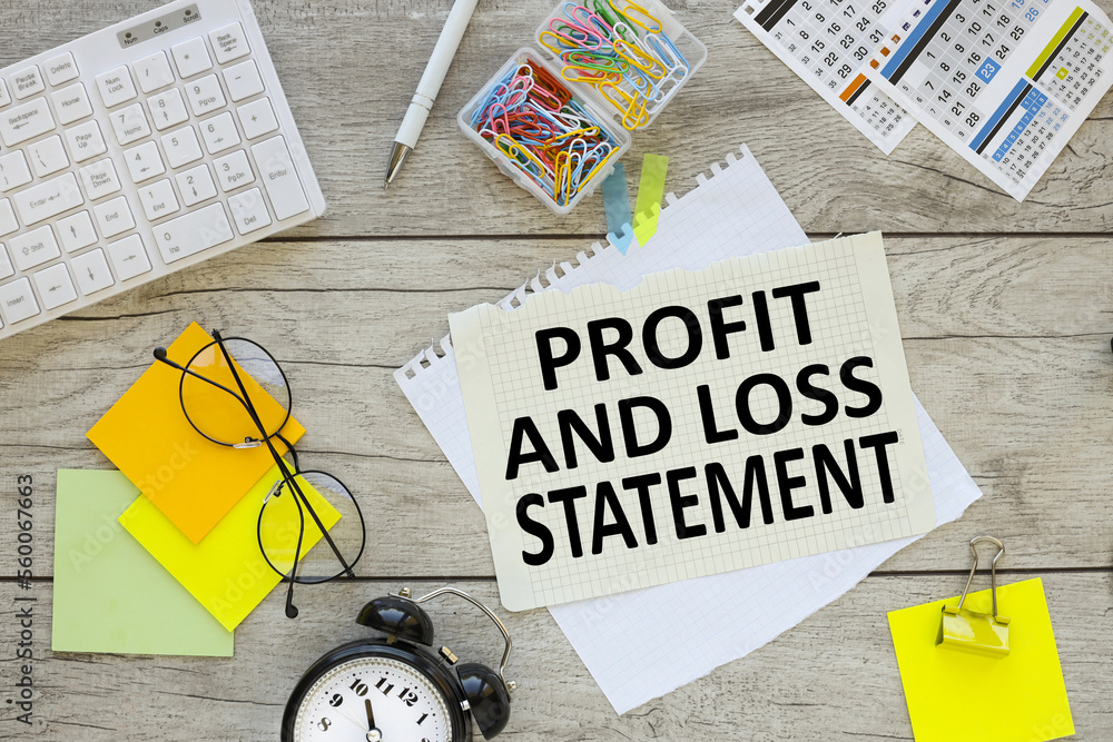 profit and loss statement, text centered top view. calendar, stickers ...