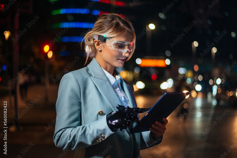 business woman with cyborg bionic arm and augmented reality visor ...