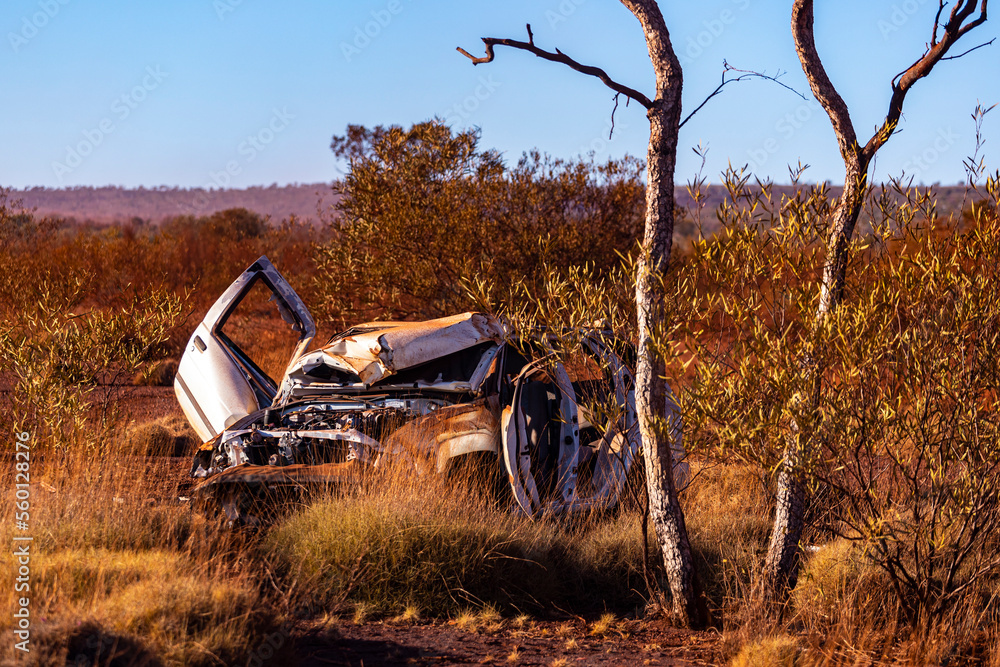 Car wreck in red sand desert, karijini national park in western ...