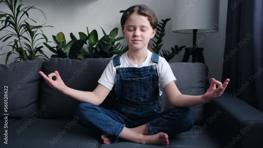 Calm beautiful child daughter practice yoga asana breath exercise with ...