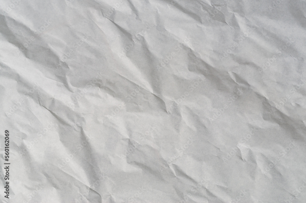 Wrinkled or crumpled white stencil paper or tissue after use in toilet ...
