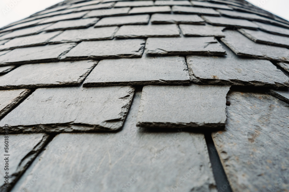 Detail of slate tiles on a medieval roof, a traditional way of ...