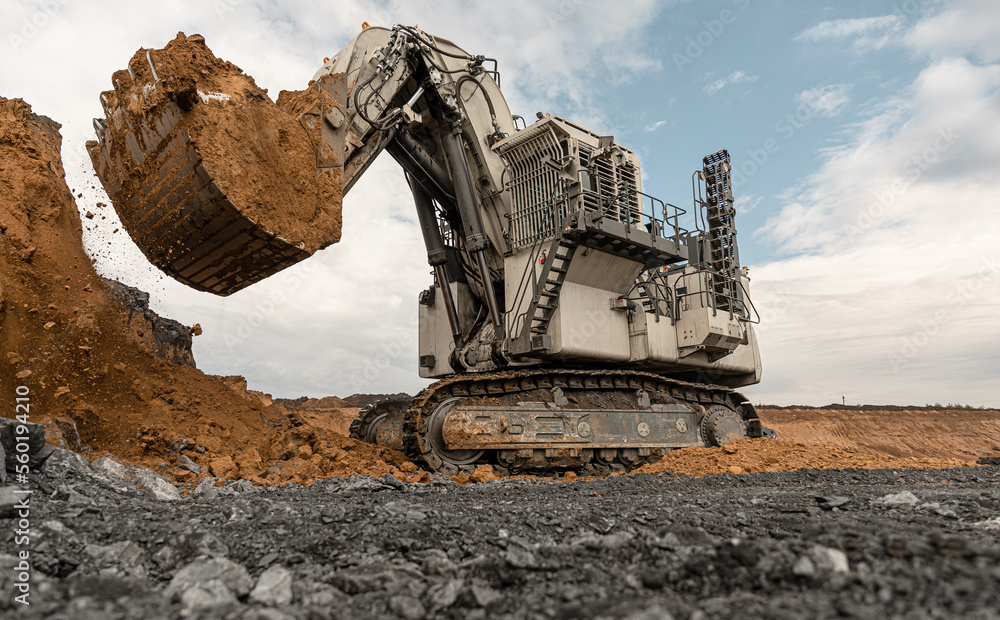 Large quarry dump excavator. Big mining truck work coal deposit ...