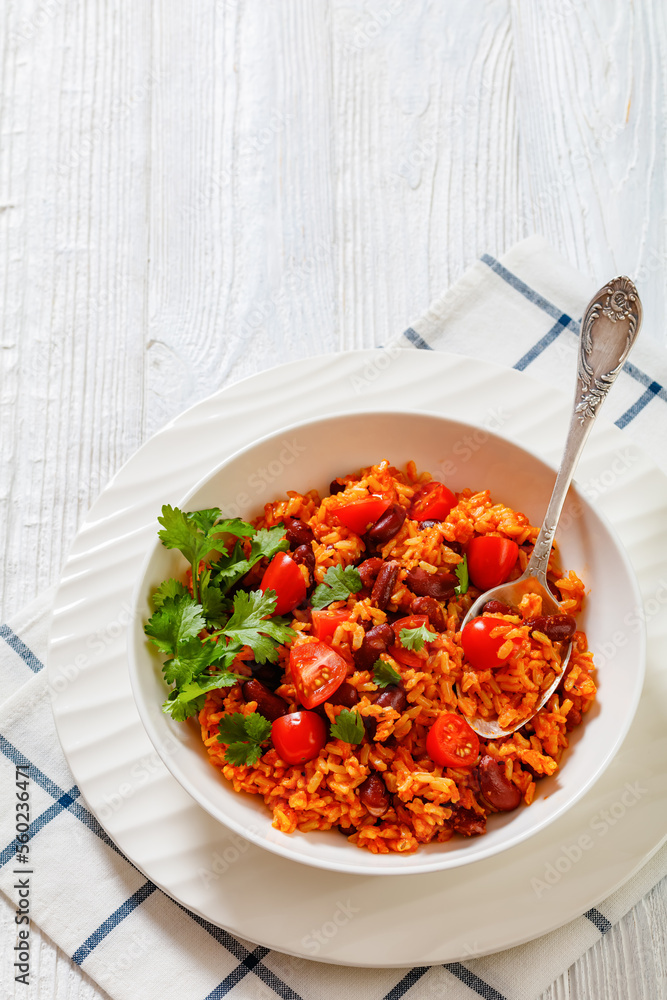 jollof rice with red beans, tomato, spices Stock Photo | Adobe Stock