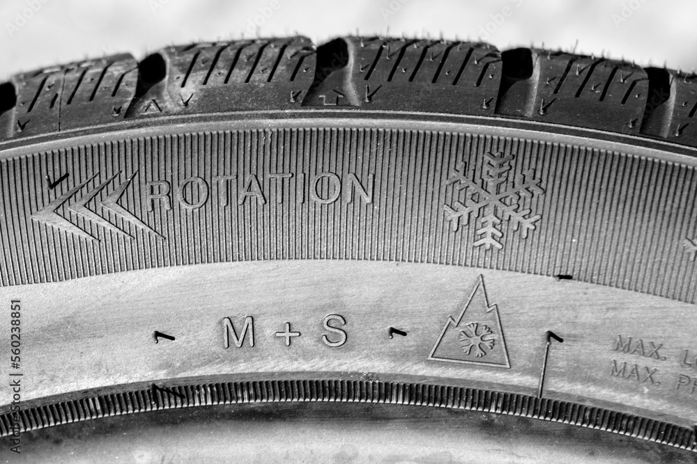 Side view of new winter tire with snowflake symbol, mud and snow and ...