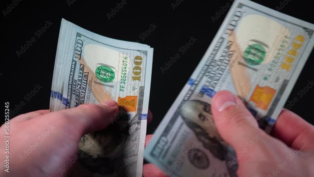 businessman counting US Dollar bill or paying in cash on money black ...