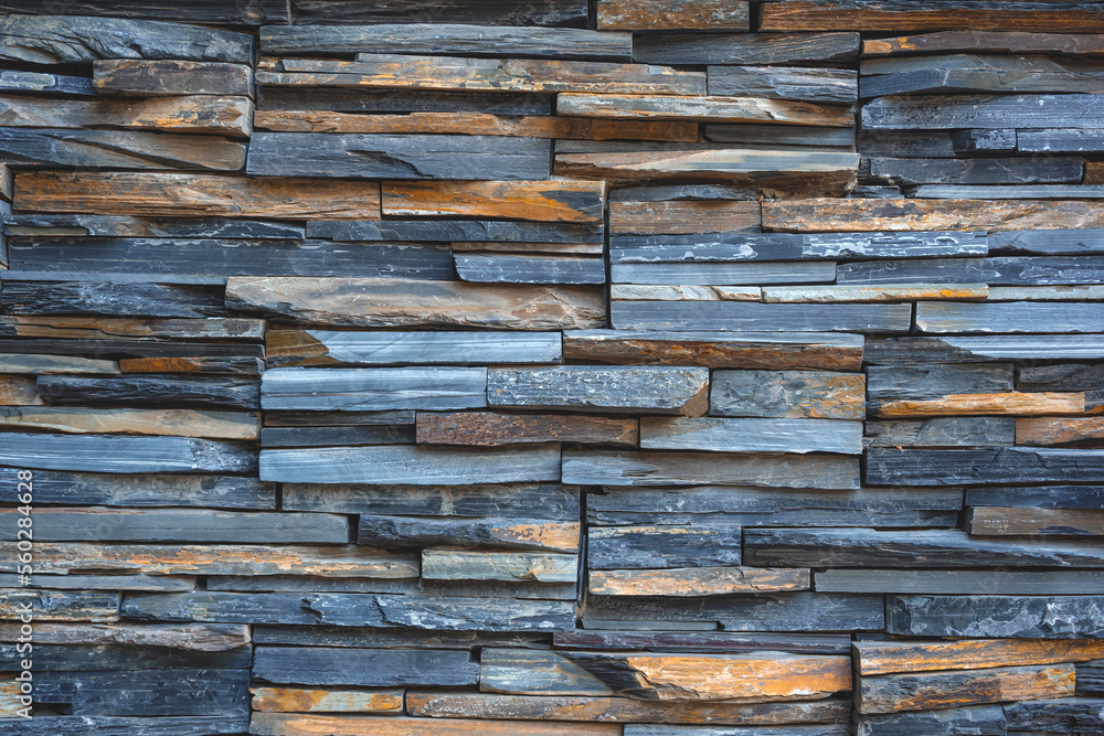 Background and texture of multicolor cladding stone slate wall in loft ...
