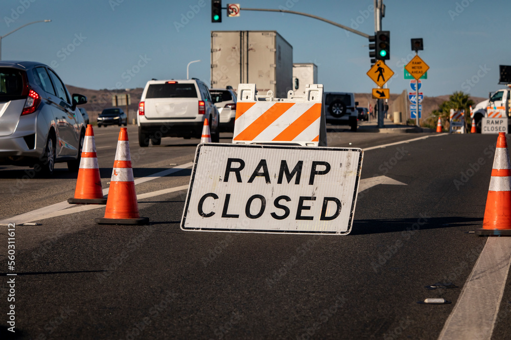 Traffic caused by a sign and cones indicating a freeway onramp is ...