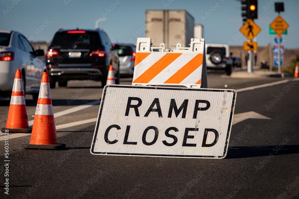 Traffic caused by a sign and cones indicating a freeway onramp is ...