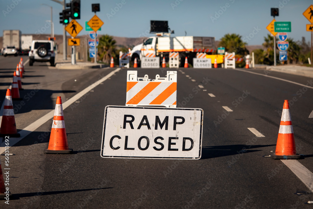 Traffic caused by a sign and cones indicating a freeway onramp is ...