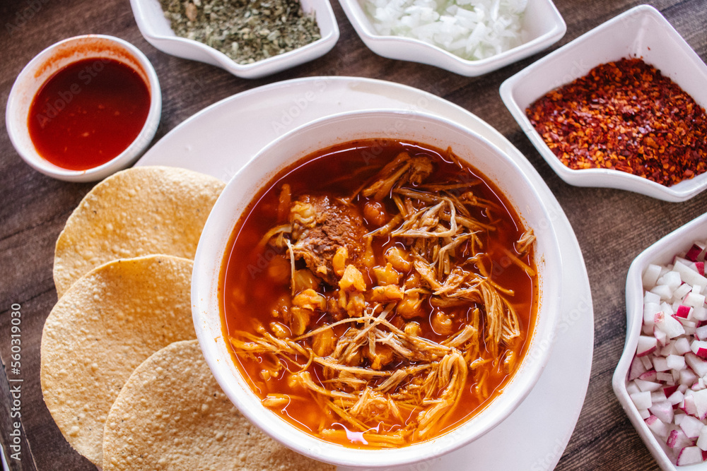 Pozole rojo con tostadas, orégano, cebolla y chile seco Stock Photo ...
