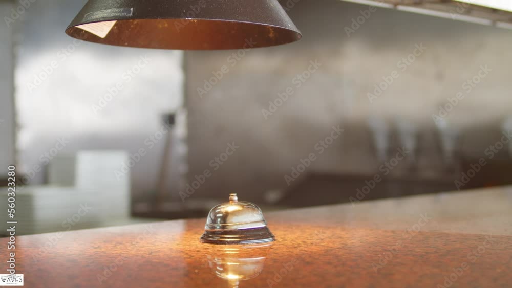 Restaurant dinner bell on a counter at a beach side bar vídeo do Stock ...