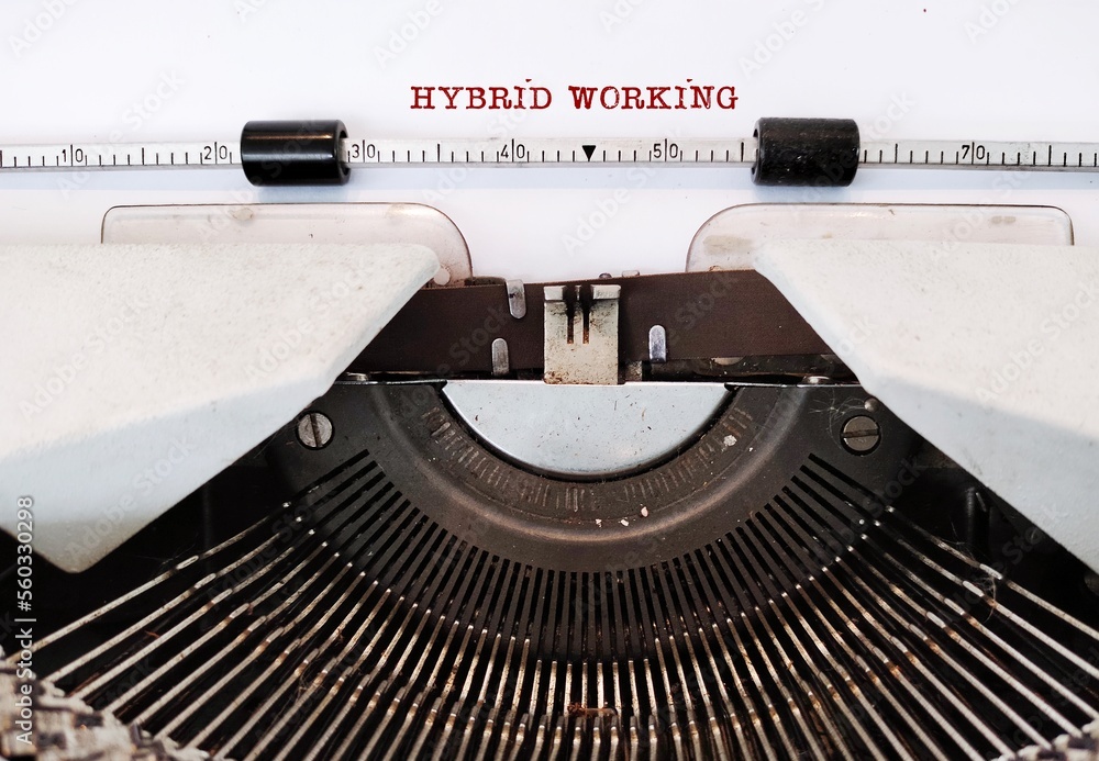 Vintage typewriter with red typed text HYBRID WORKING, means flexible ...