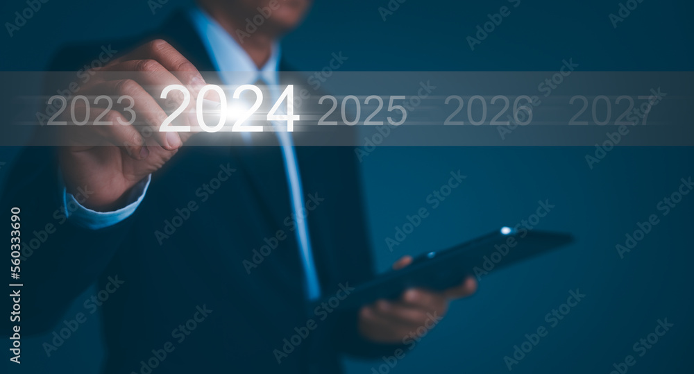 Happy new year 2024 hand touch on a virtual screen 2024. New Goals ...