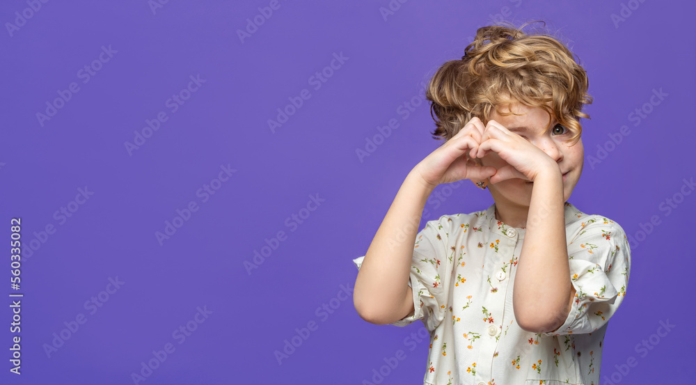 Cute caucasian girl child elementary school making hands in heart shape ...