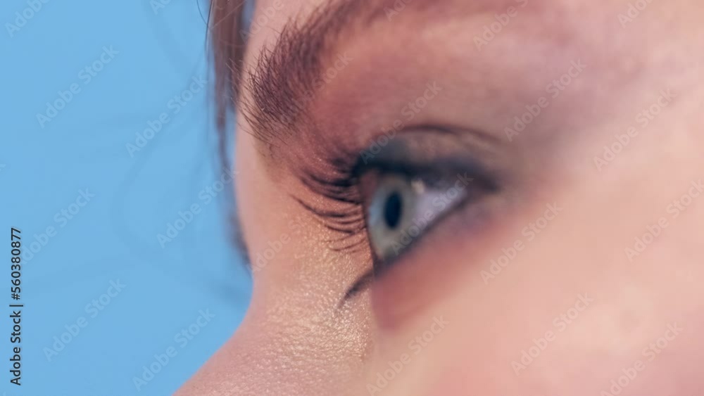 Female Human eye closeup. Side view. Girl's eye with brown color makeup ...